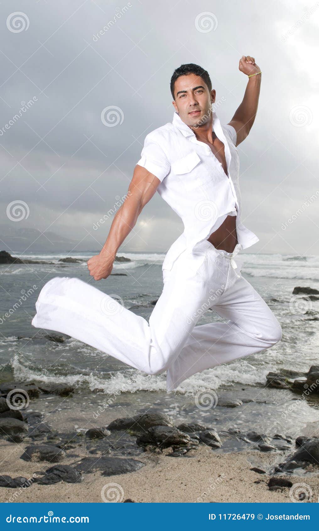 Man near the sea jumping stock image. Image of beautiful - 11726479
