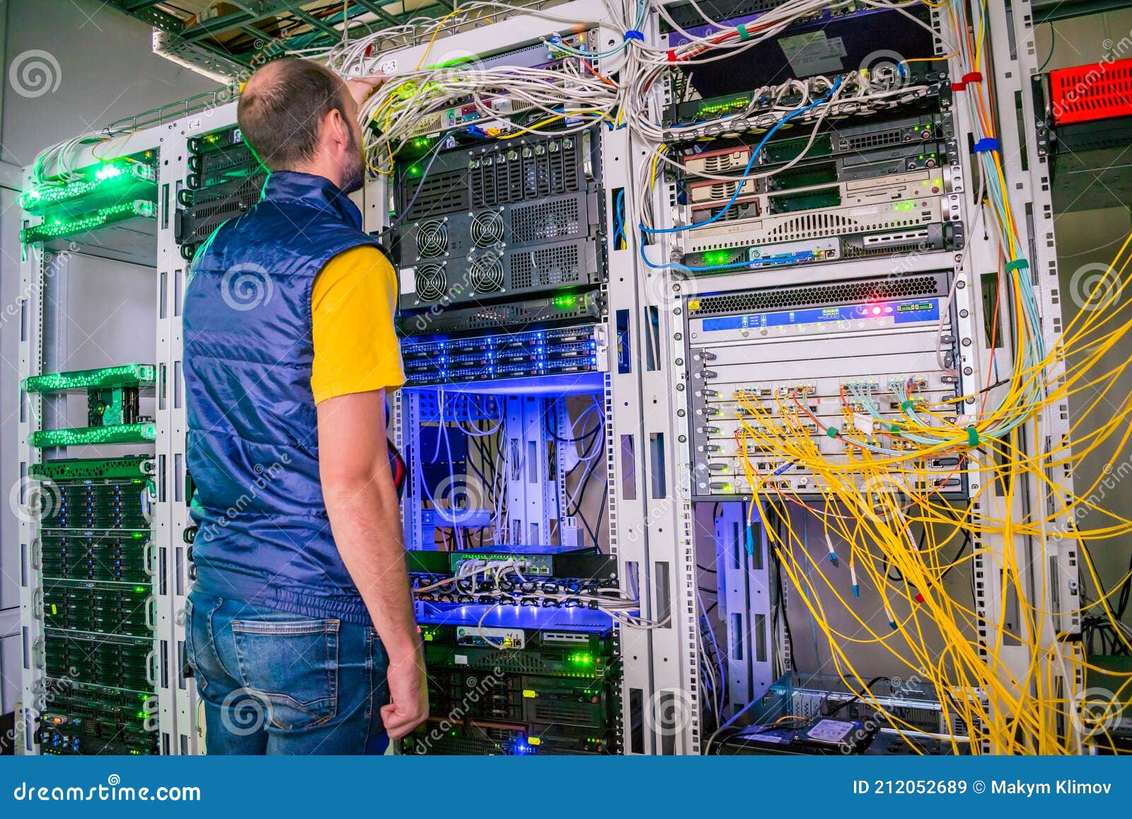 The Man Is Near The Server Racks Of The Data Center Technician Will Check The Work Of Computer
