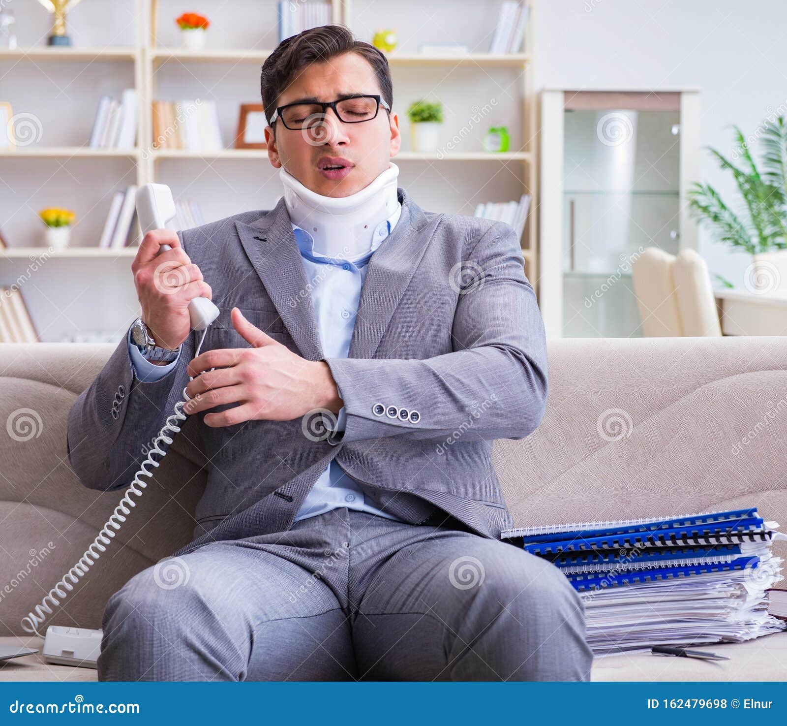 Man in Neck Brace Cervical Collar Working from Home Teleworking Stock ...