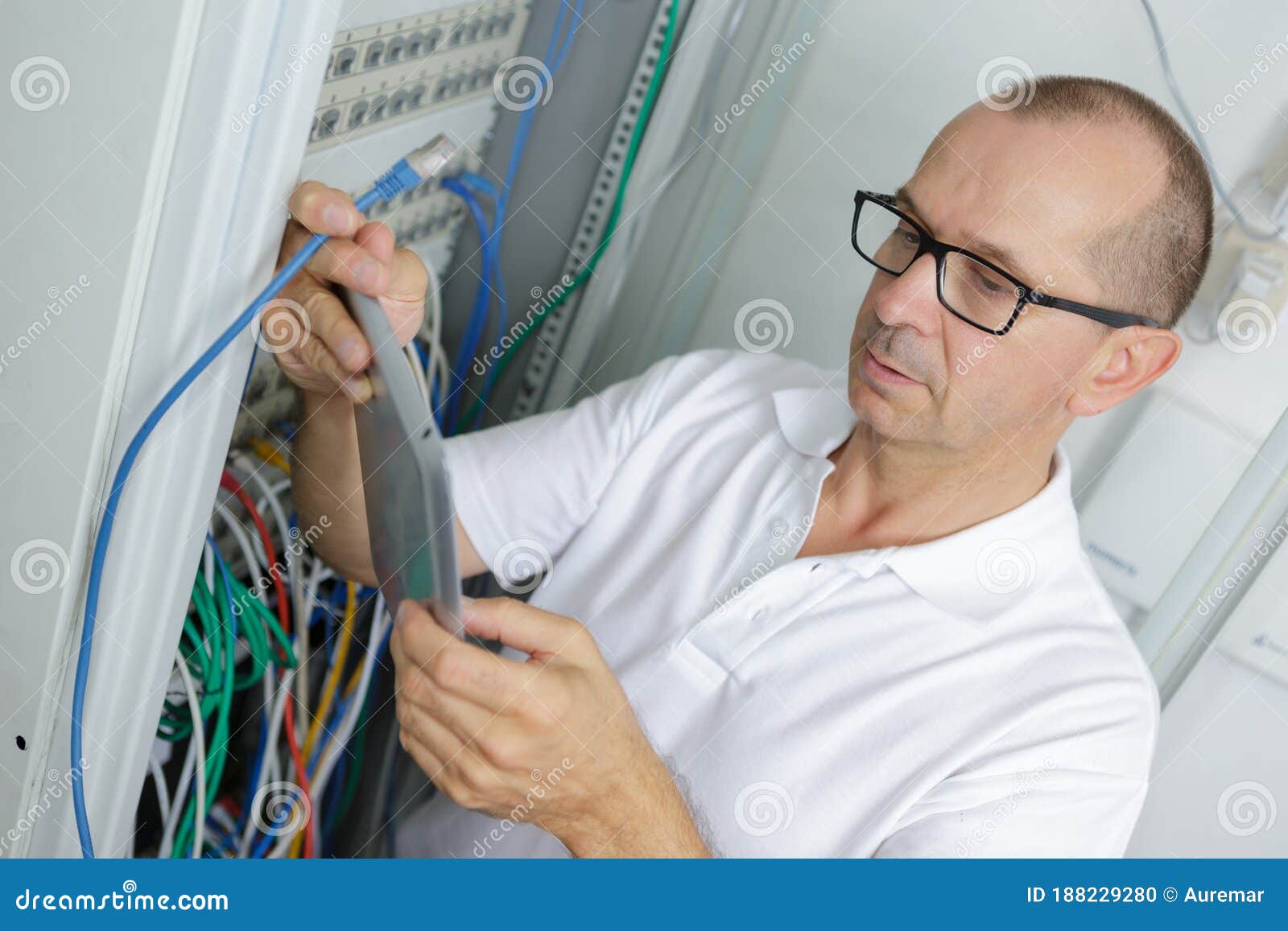 Man in network server room stock photo. Image of server - 188229280
