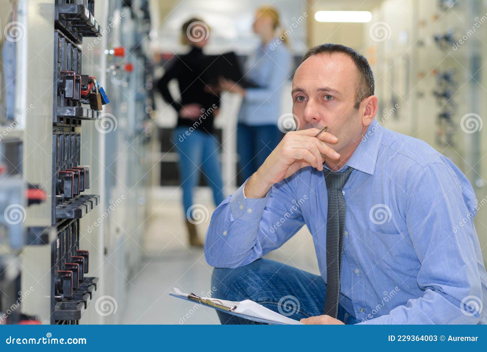 Man in network server room stock image. Image of wire - 229364003
