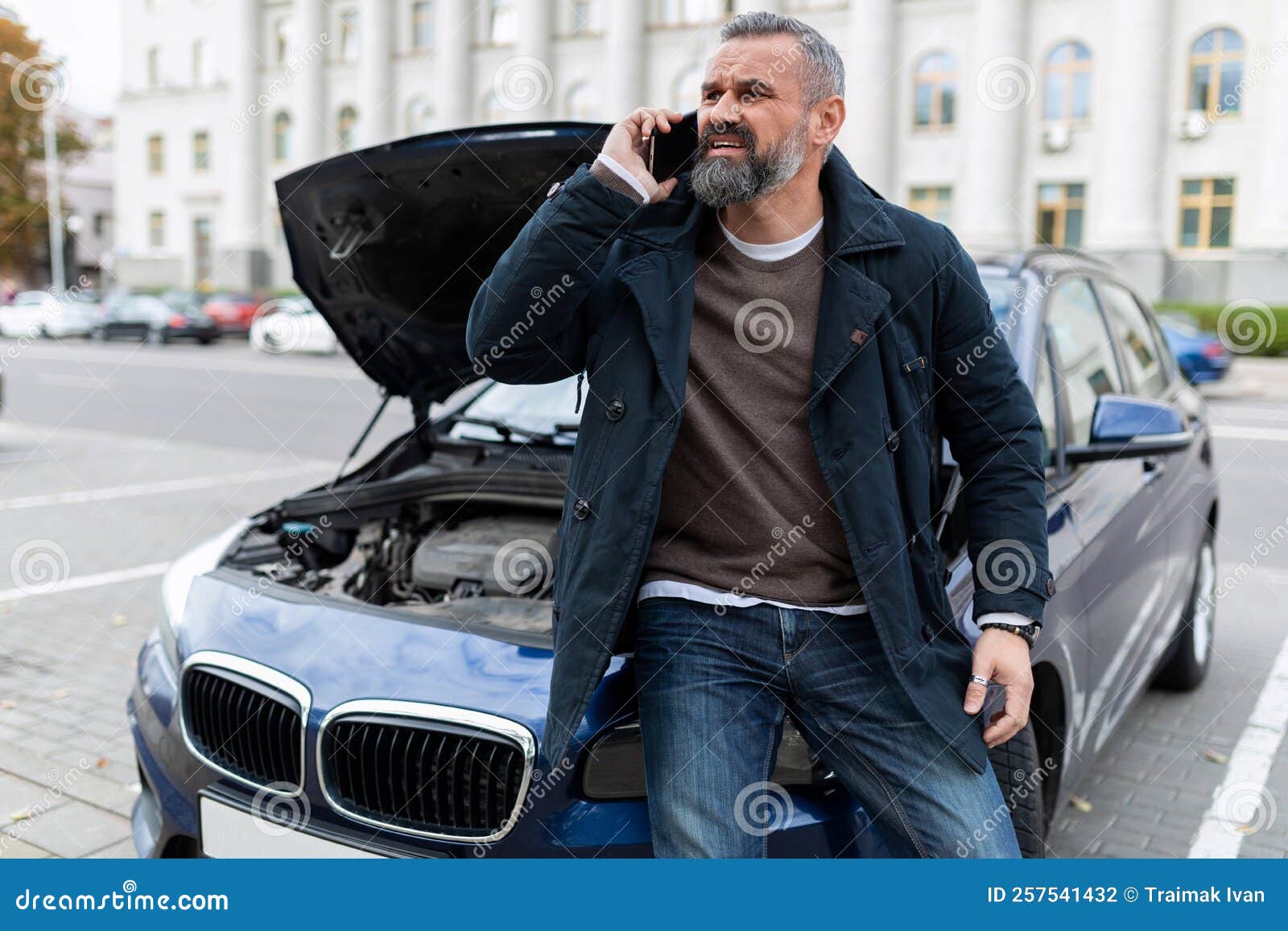 A Man Next To a Broken Car Calls the Rescue Service Stock Photo - Image ...