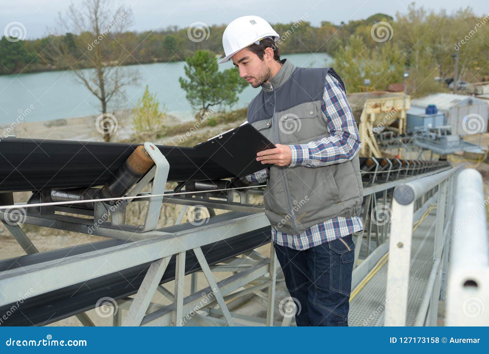 Man Next To Elevator in Quarry Stock Photo - Image of mineral ...