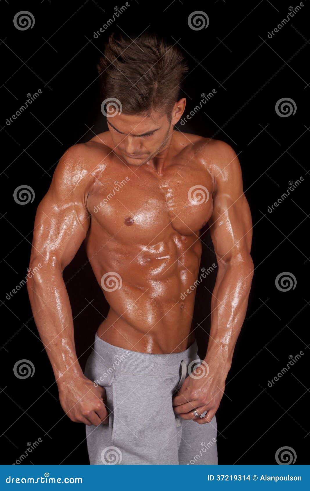 Man No Shirt Shiny Look Down at Muscles Stock Photo - Image of bare ...
