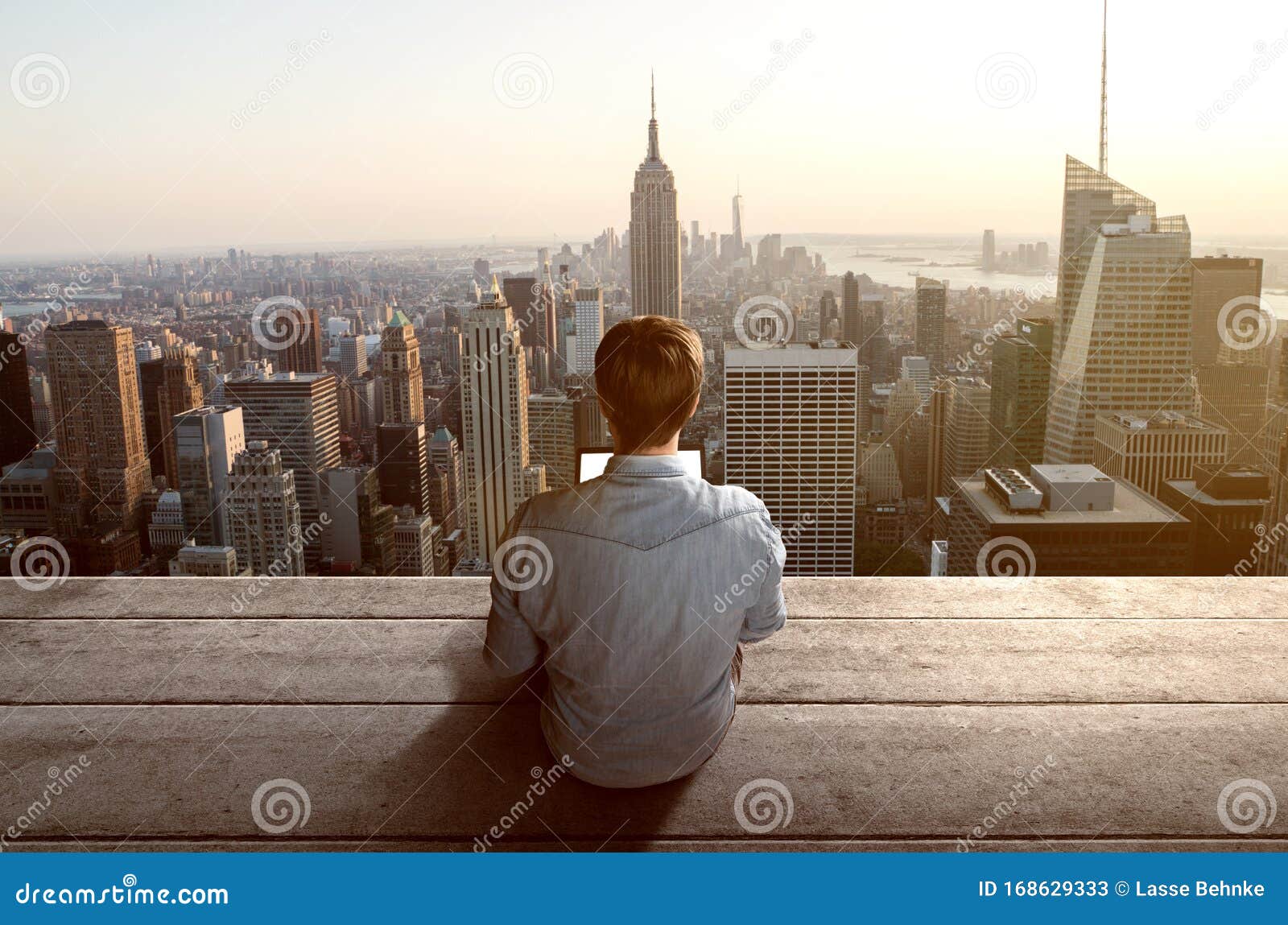 Man with Notebook on Rooftop Stock Image - Image of work, city: 168629333