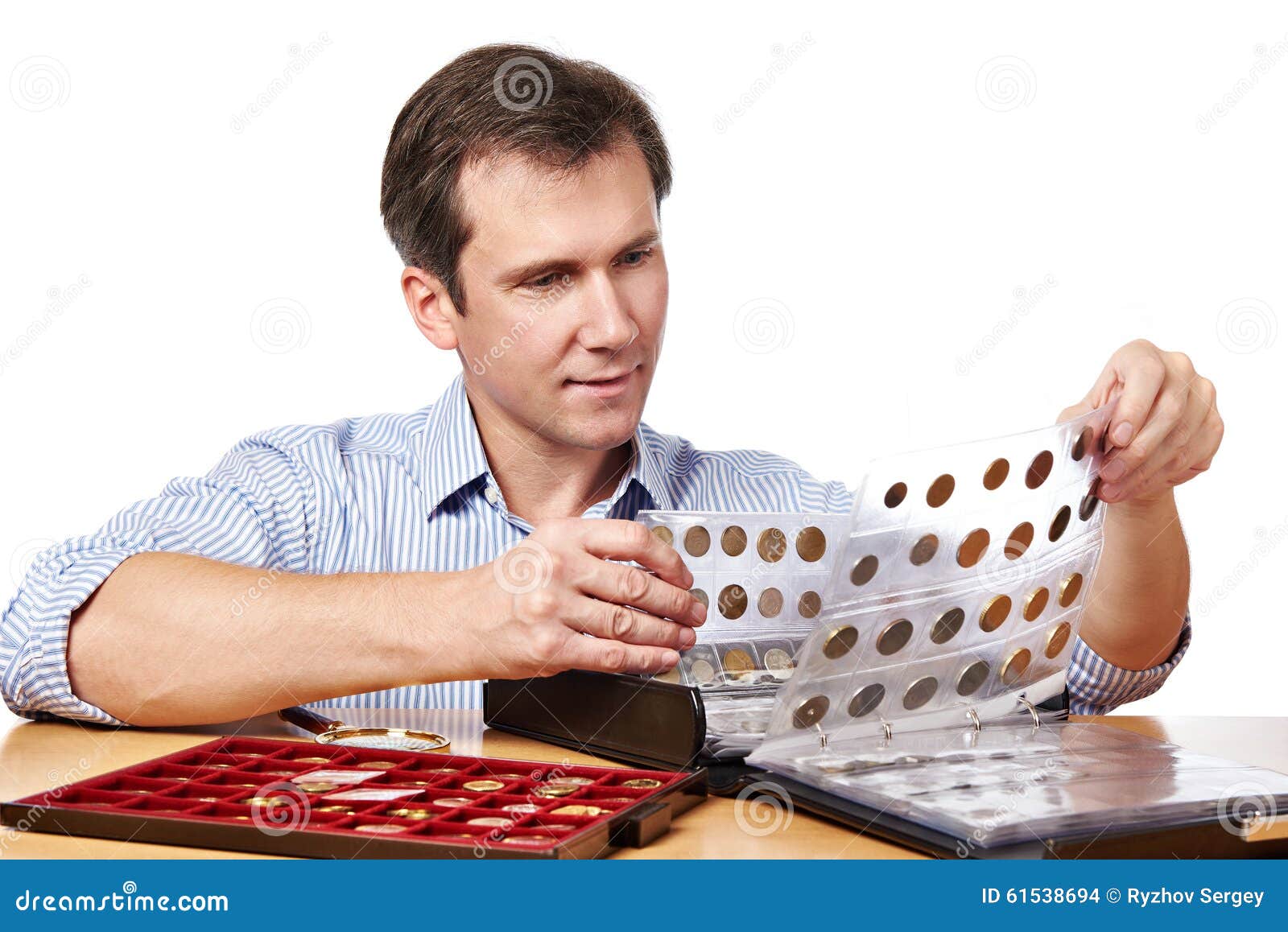 Man Numismatist Examines His Collection of Coin Stock Photo - Image of ...