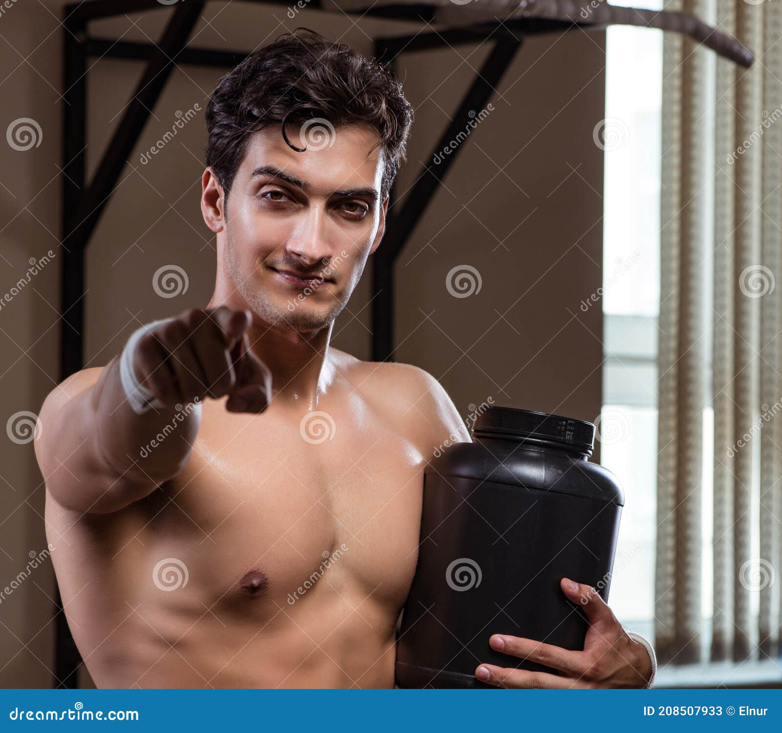 Man with Nutrient Supplements in Sports Gym Stock Image - Image of club ...