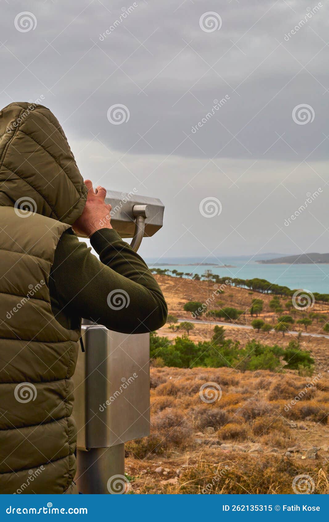 A Man on an Observation Deck Looks through a Telescope Stock Image ...