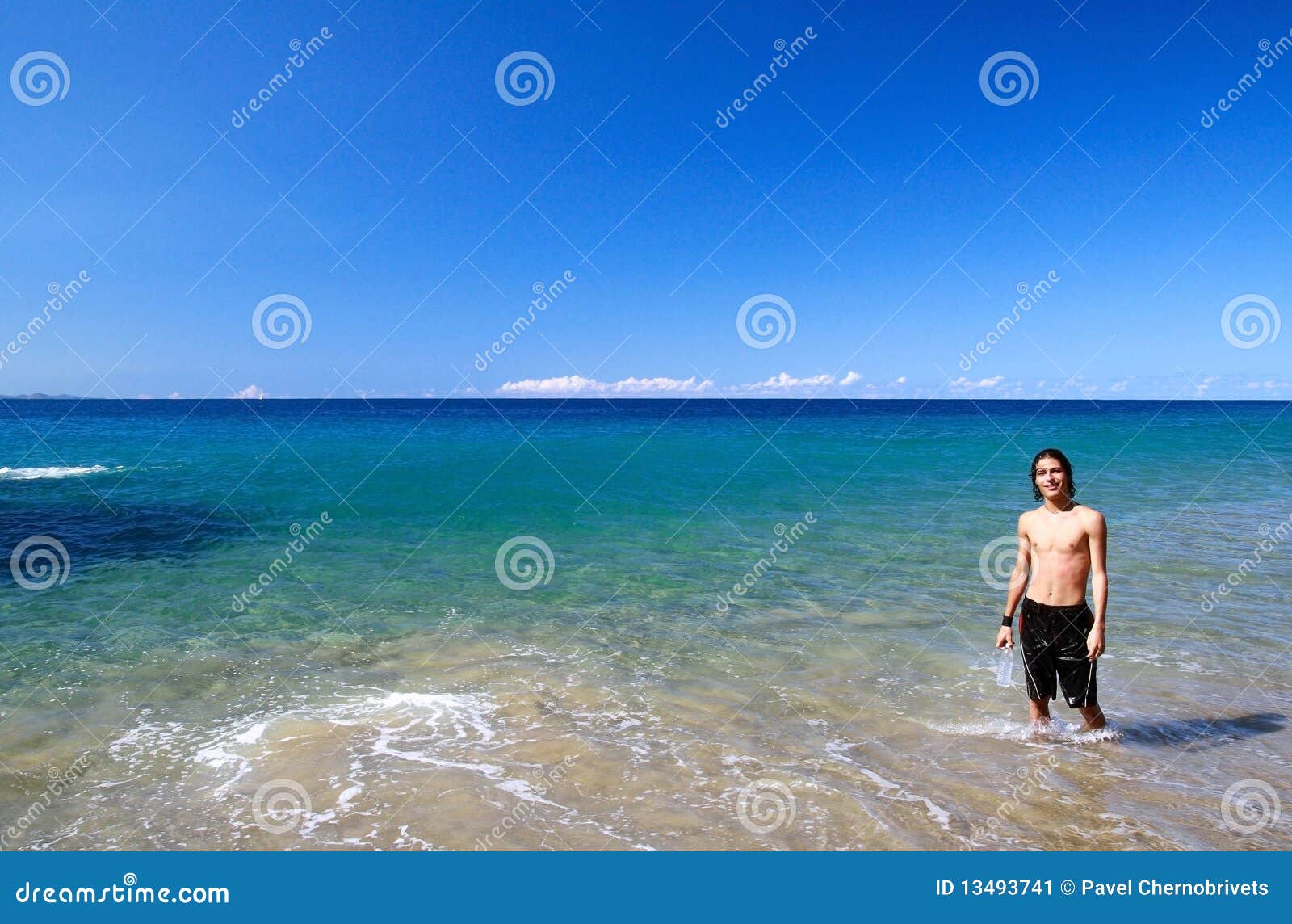 Man in ocean stock image. Image of horizon, blue, beach - 13493741