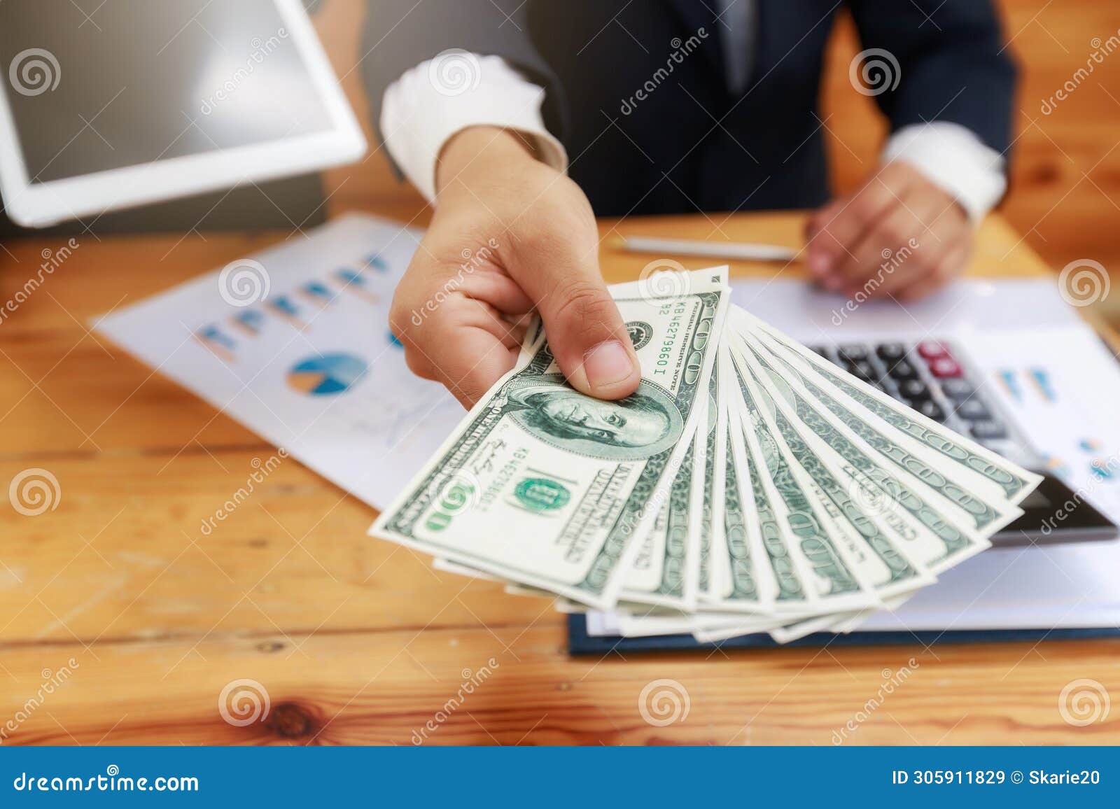 Man Offering Batch of Hundred Dollar Bills. Man Displaying a Spread of ...