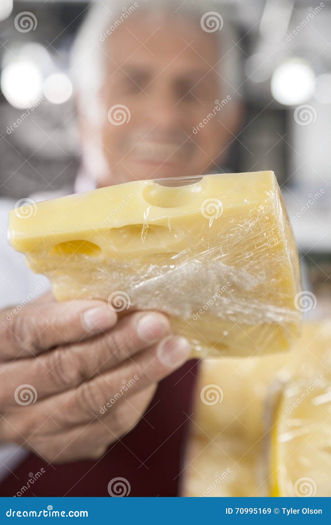 Man Offering Cheese in Grocery Store Stock Image - Image of salesman ...