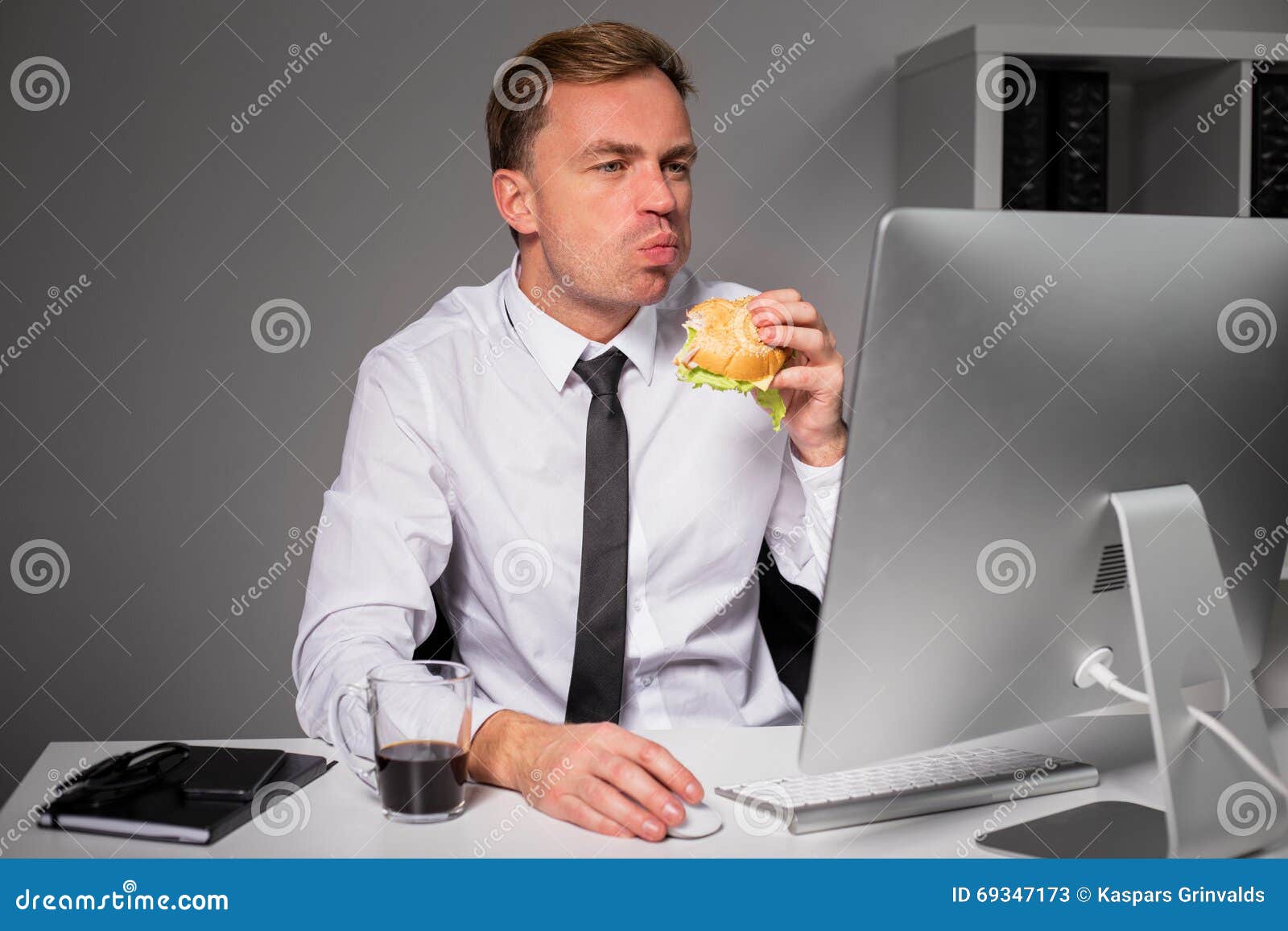 Man at the Office Eating Burger Stock Image - Image of hamburger ...