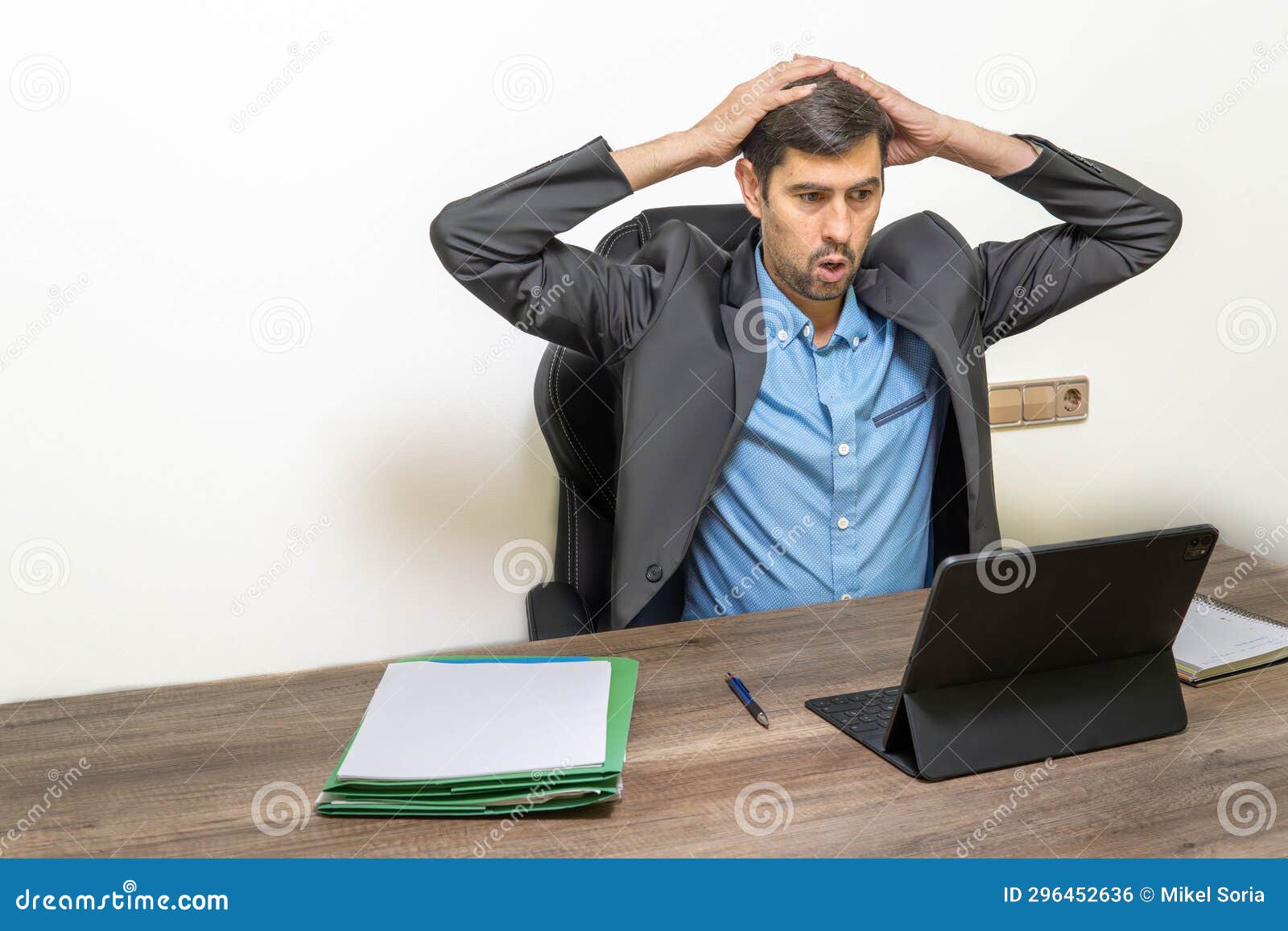 Man in the Office with His Arms Above His Head with a Surprised ...