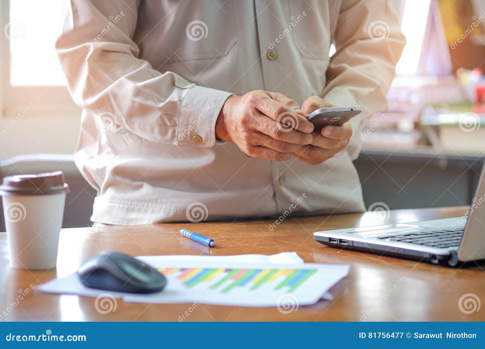 Man Office Staff Using Smart Phone with Analyzing Graphs. Stock Image ...