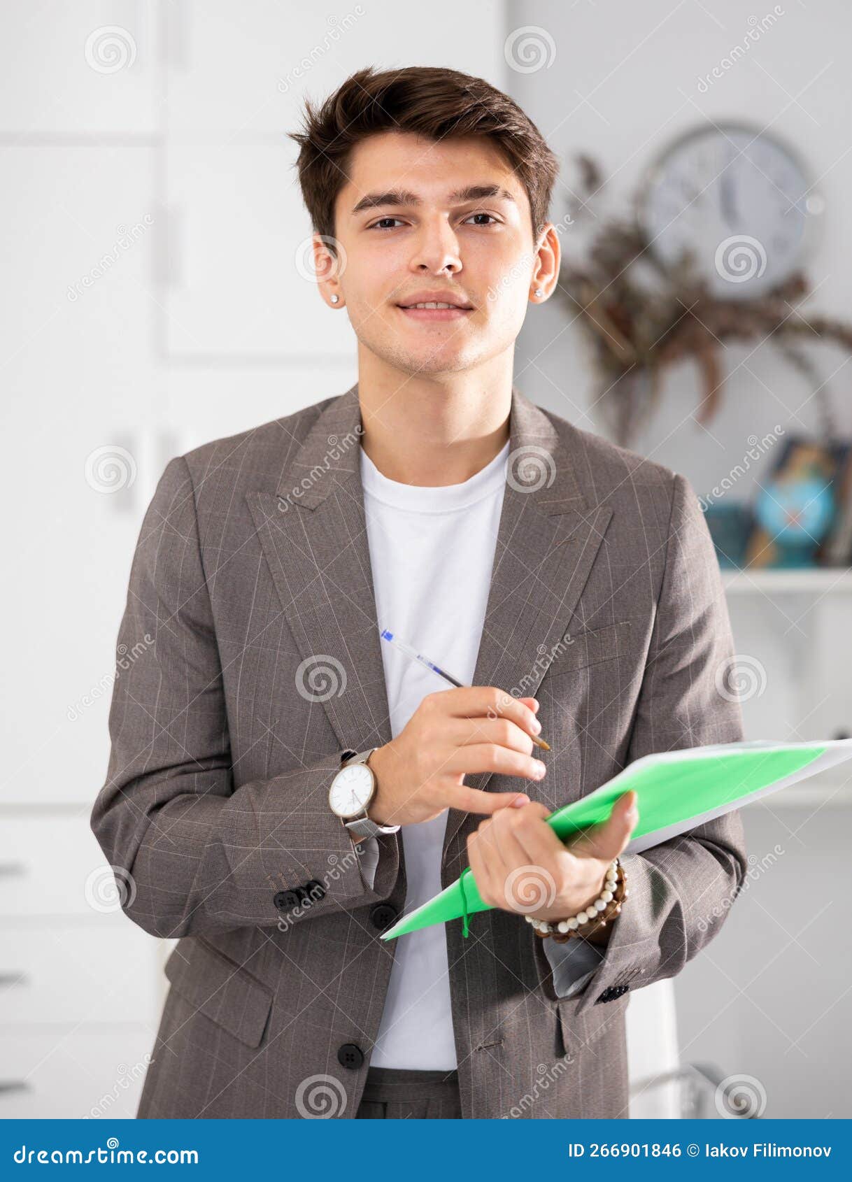 Positive Man Office Worker Holding Folder in Hands and Looking at ...