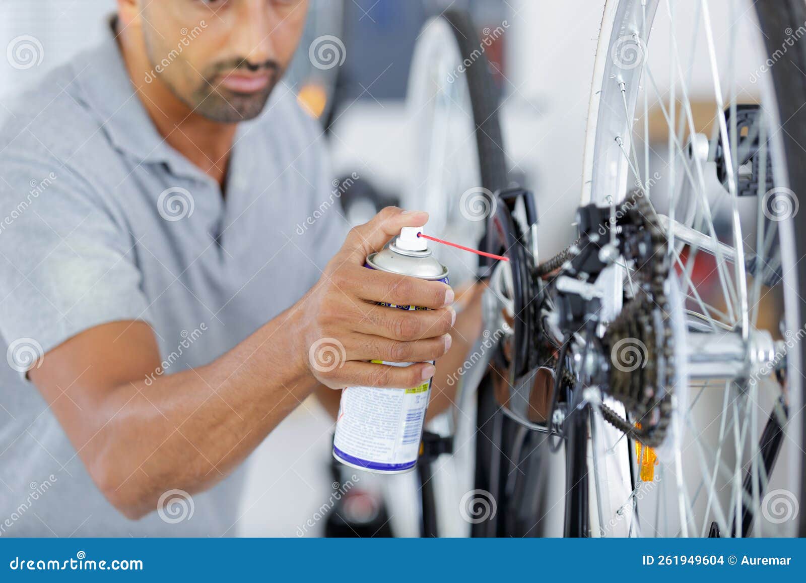 Man Oiling Bicycle Chain and Gear with Oil Spray Stock Photo - Image of ...