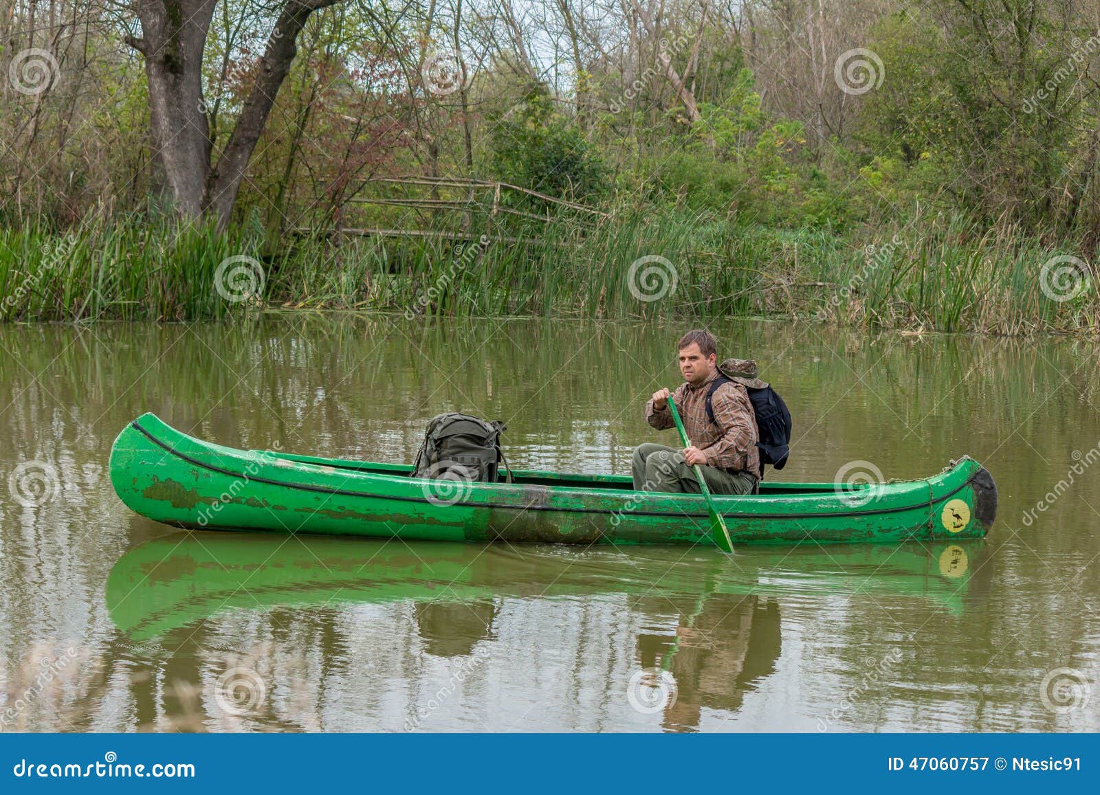 Old Canoe On River