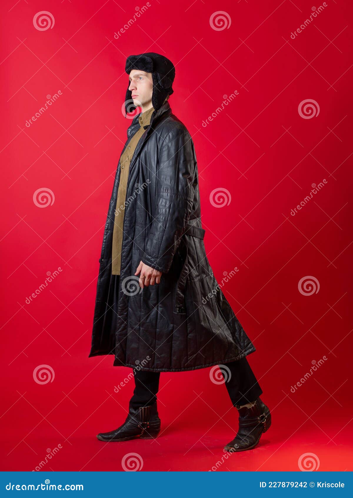 A Man in Old-fashioned Clothes and a Hat with Earflaps, Russian Post ...