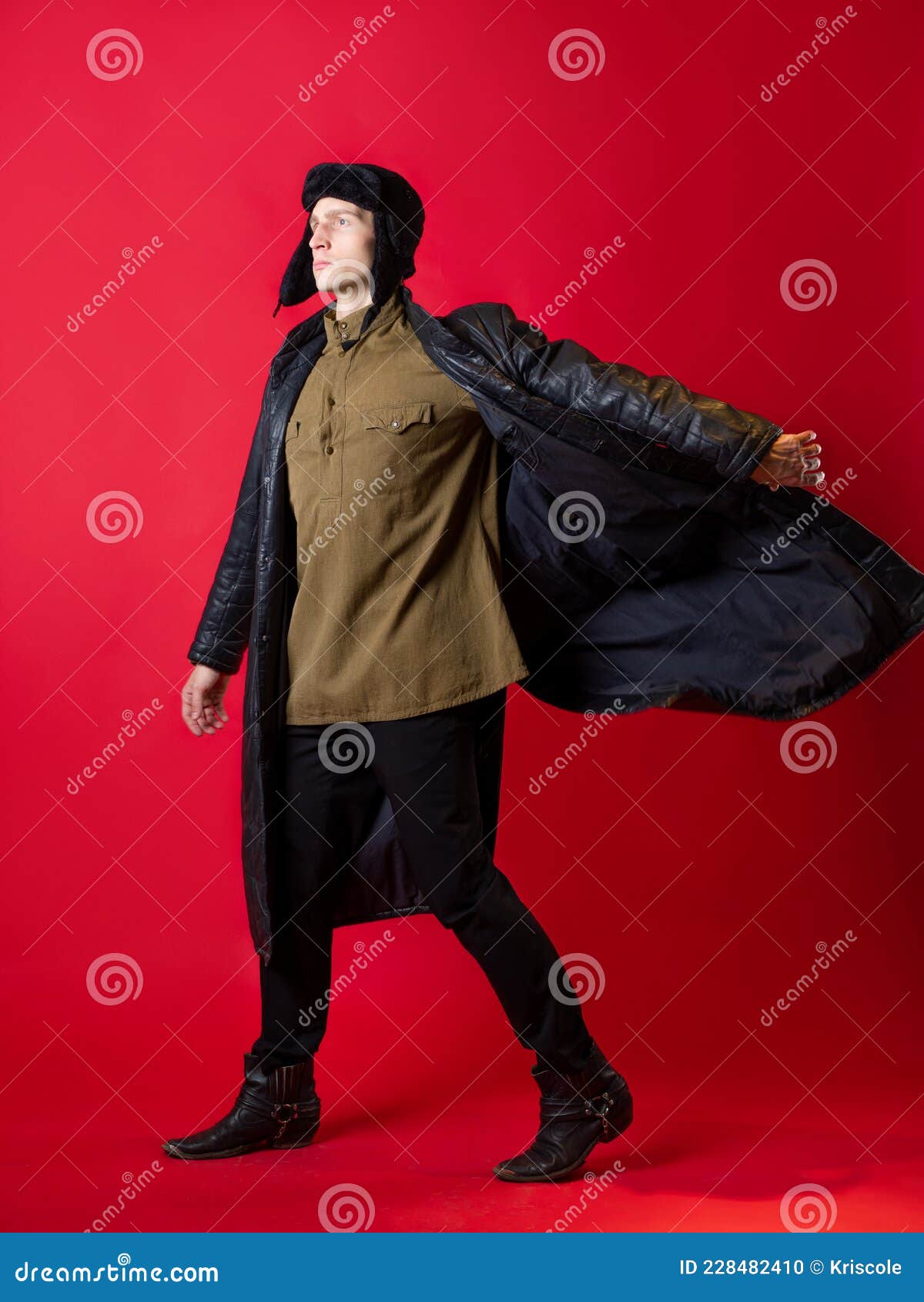 A Man in Old-fashioned Clothes and a Hat with Earflaps, Russian Post ...