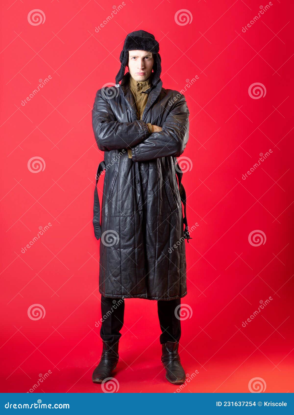 A Man in Old-fashioned Clothes and a Hat with Earflaps, Russian Post ...