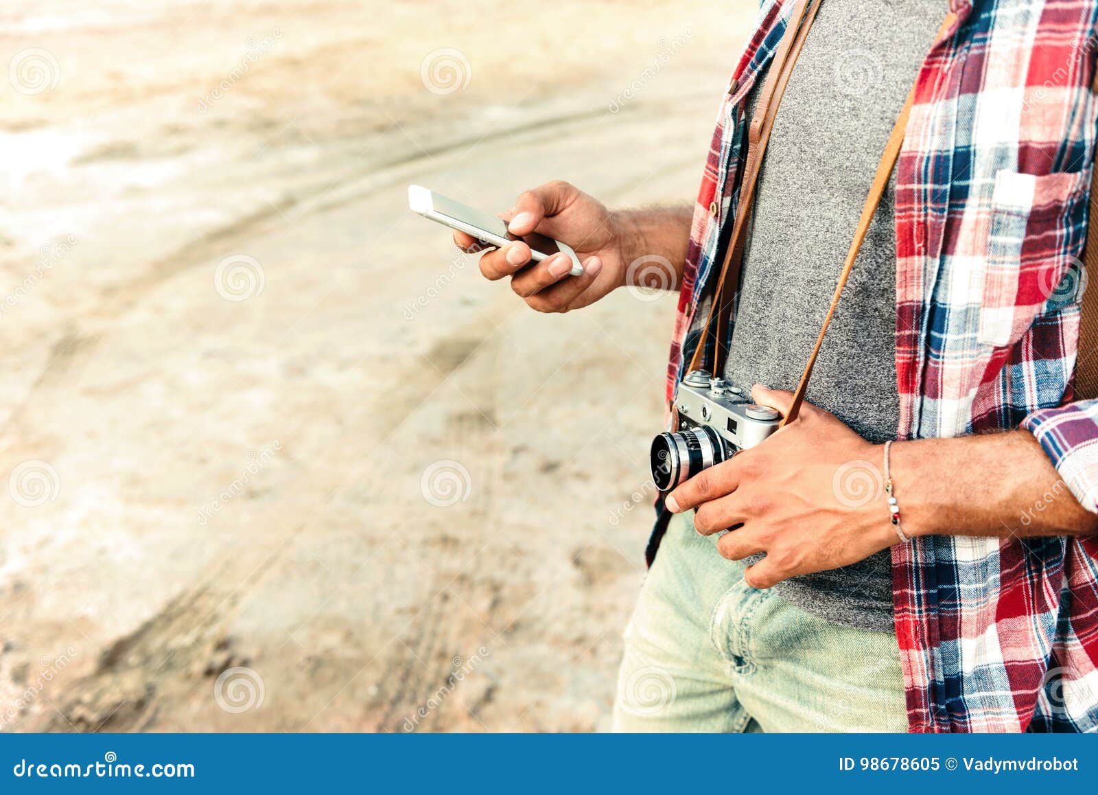 Man with Old Vintage Photo Camera Using Cell Phone Stock Image - Image ...