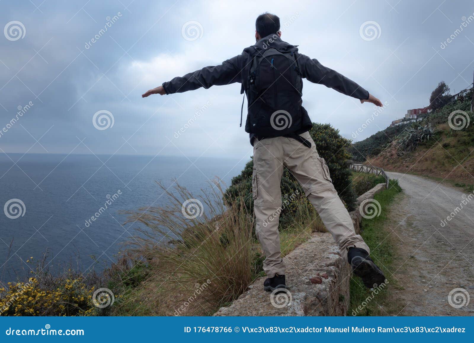 Man on One Foot Climbed on a Wall Stock Photo - Image of health, active ...