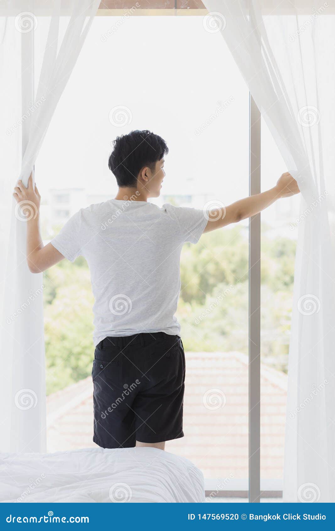 Man Open the Curtain and Look Outside the Window Stock Photo - Image of ...