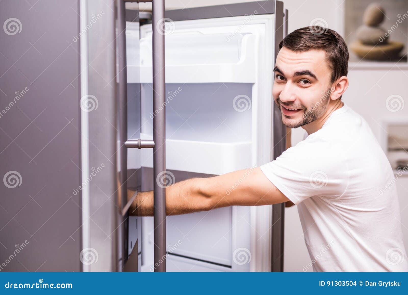 Man Open Refrigerator Door and Seach Food in the Kitchen at Home Stock ...
