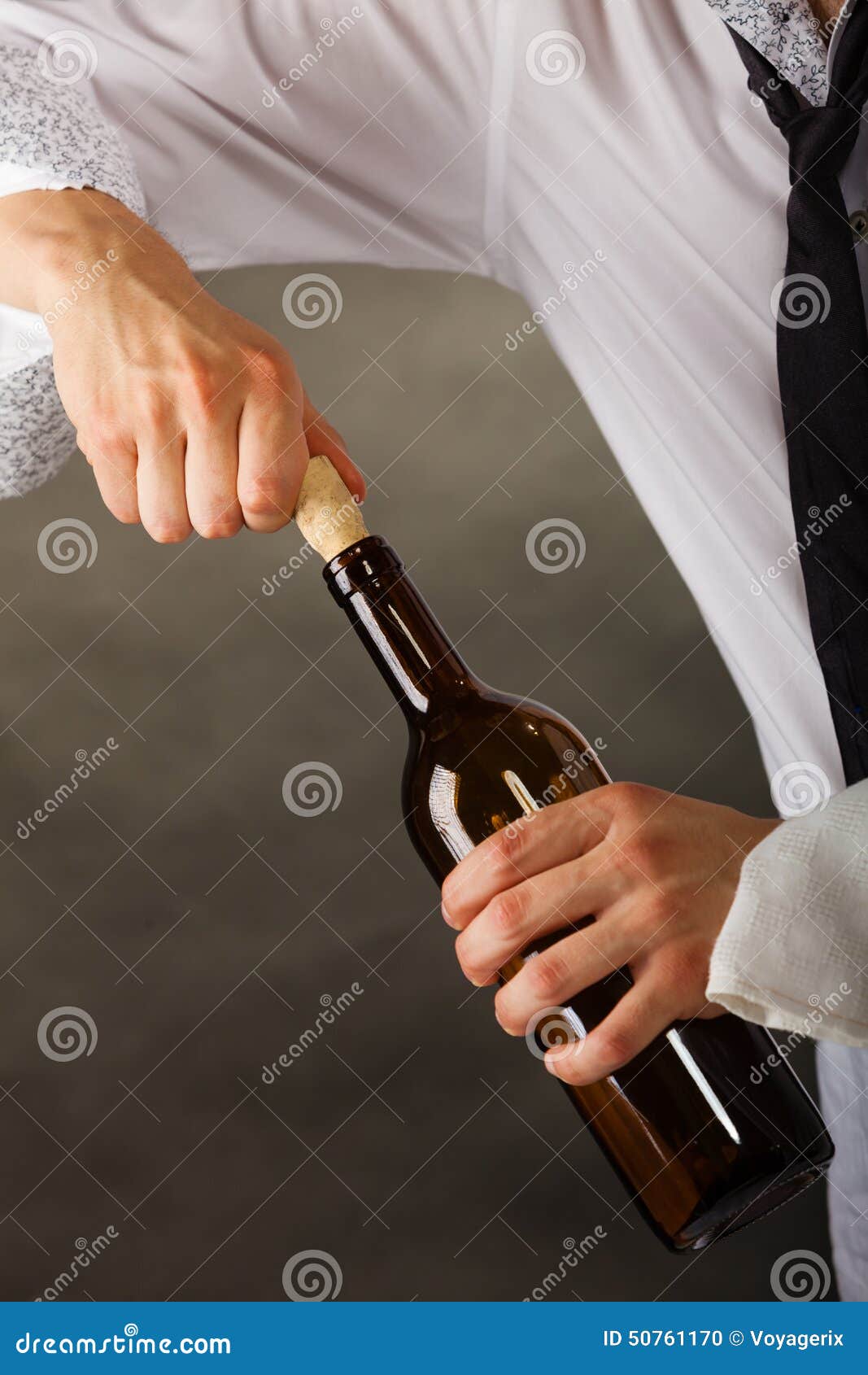 Man opening bottle of wine stock photo. Image of wainglass - 50761170