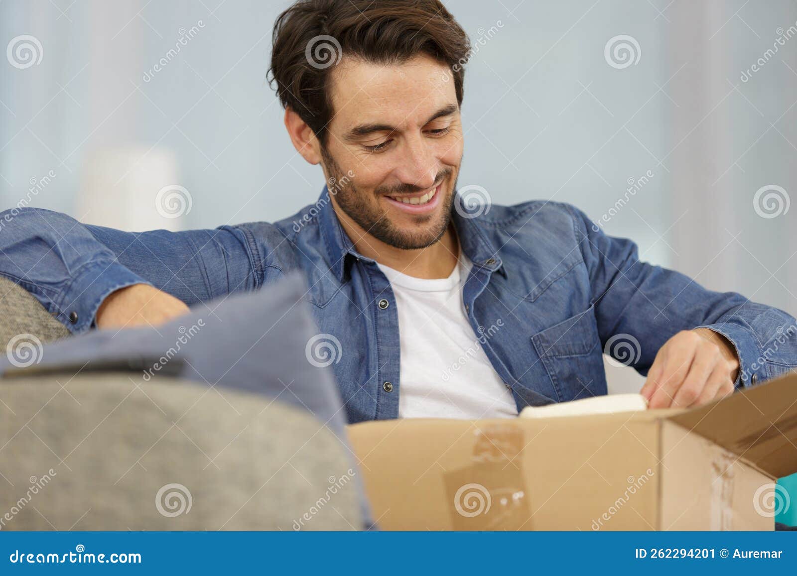Man opening a box stock image. Image of consumerism - 262294201