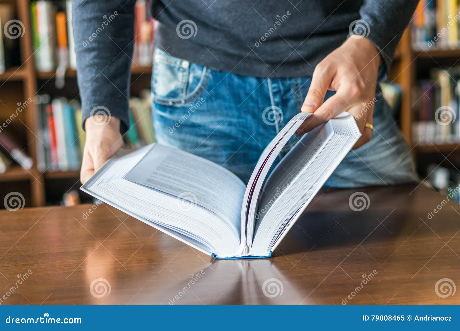 The Man Opening and Browsing the Book Pages Stock Image - Image of ...
