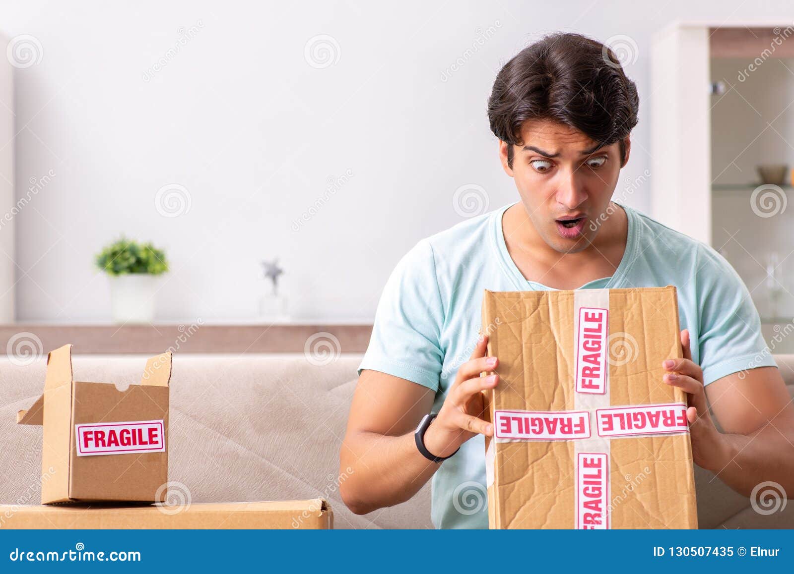 The Man Opening Fragile Parcel Ordered from Internet Stock Image ...