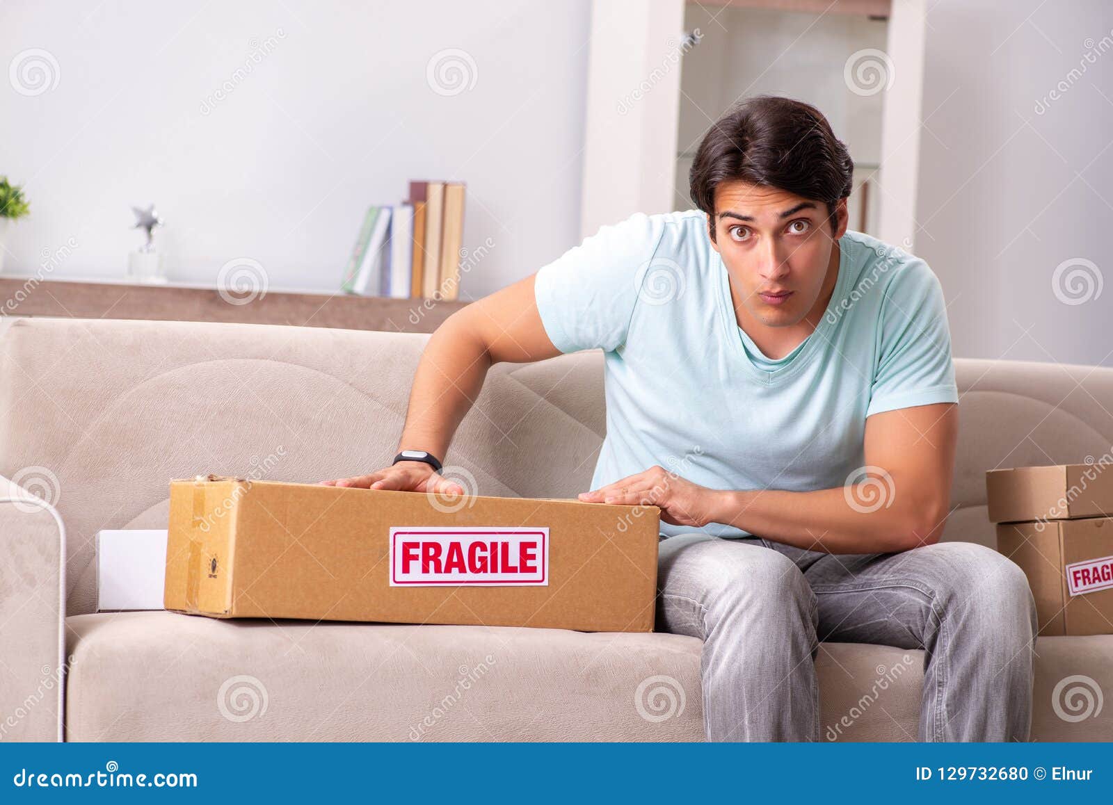 The Man Opening Fragile Parcel Ordered from Internet Stock Photo ...