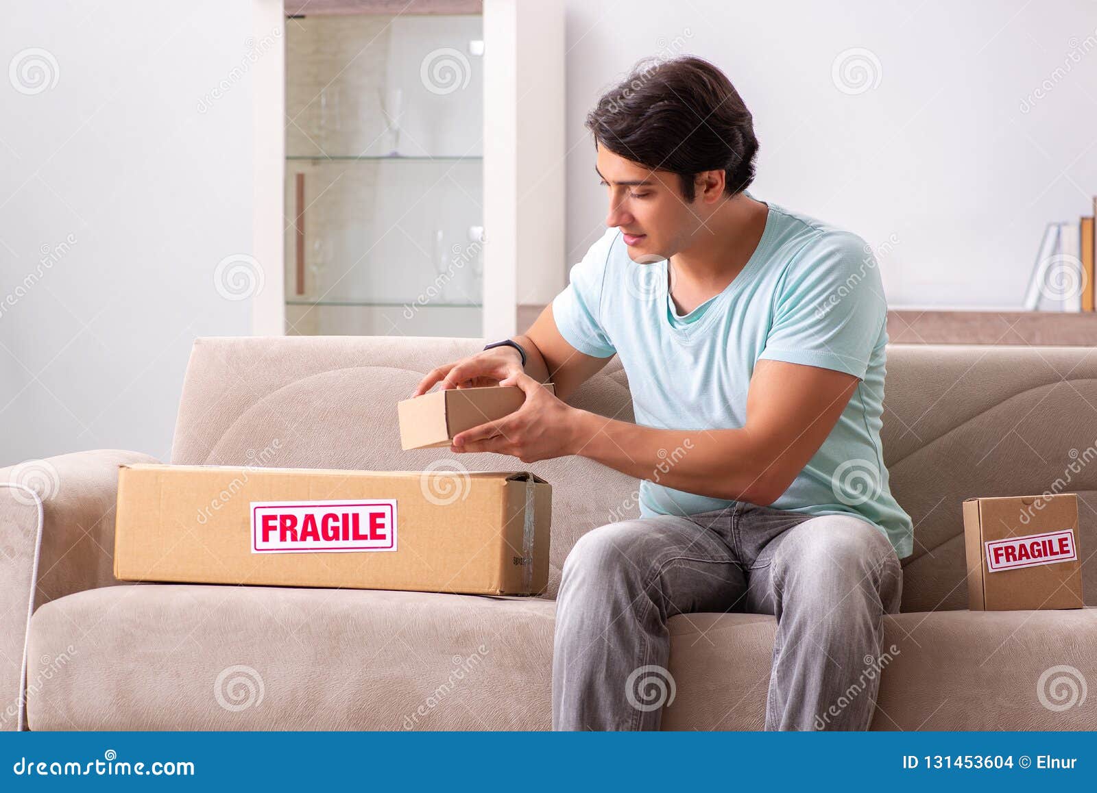 The Man Opening Fragile Parcel Ordered from Internet Stock Photo ...