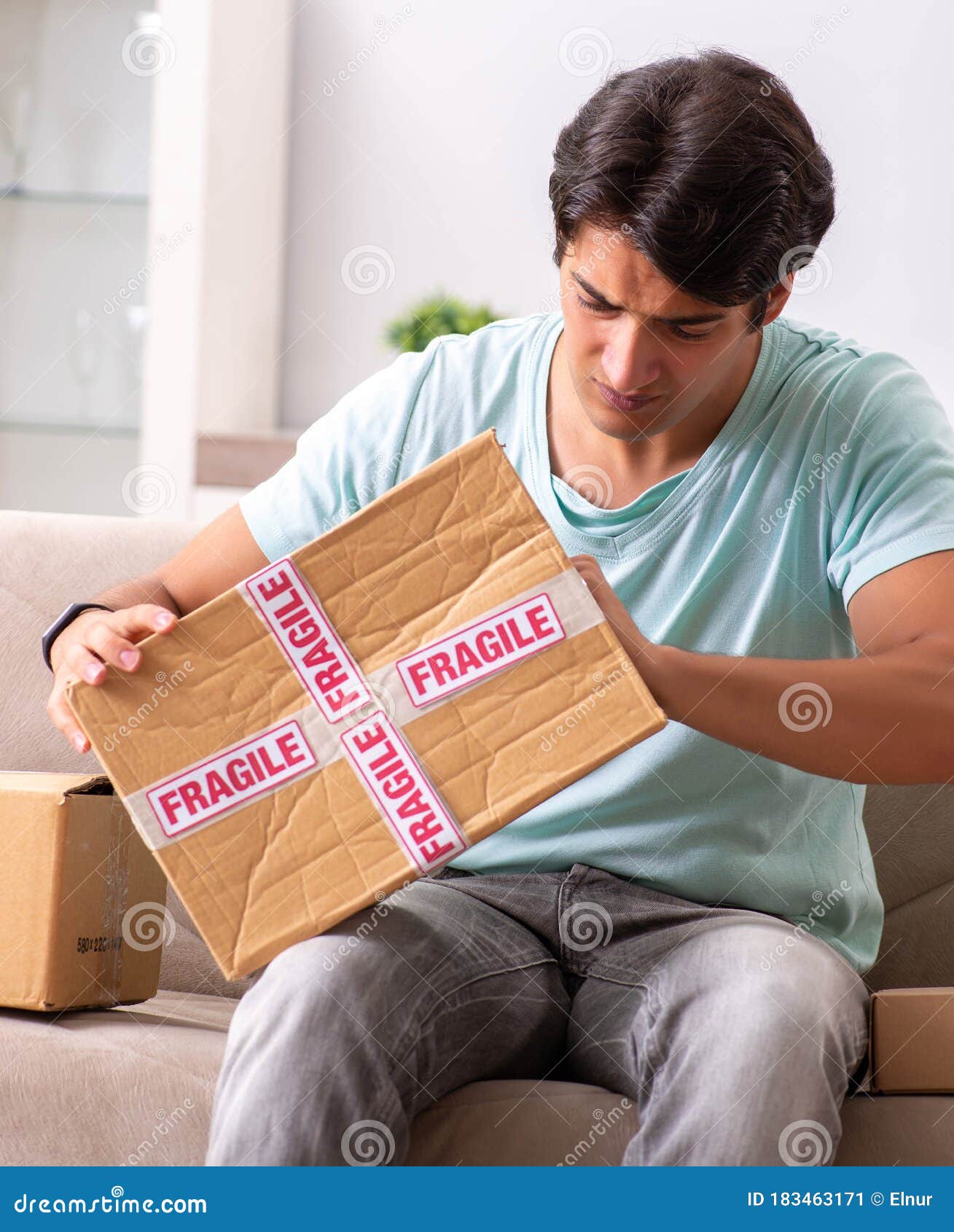 Man Opening Fragile Parcel Ordered from Internet Stock Image - Image of ...