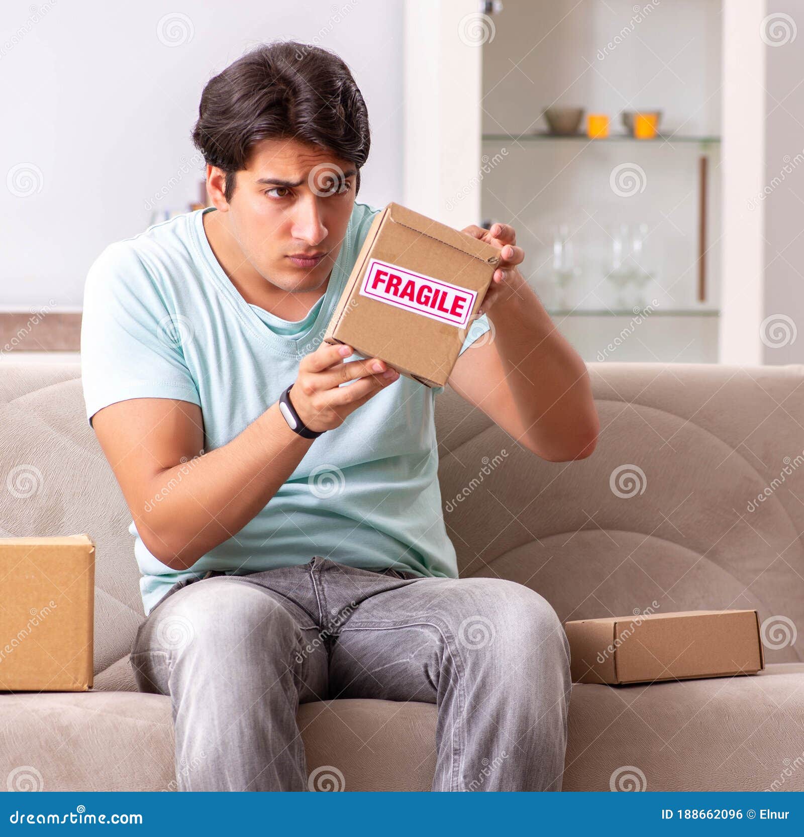 Man Opening Fragile Parcel Ordered from Internet Stock Photo - Image of ...