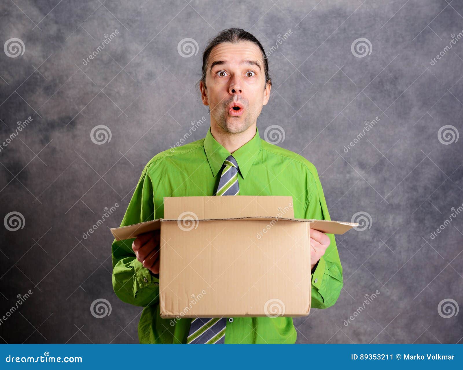 Man Opening a Package and Looking Surprised Stock Image - Image of ...