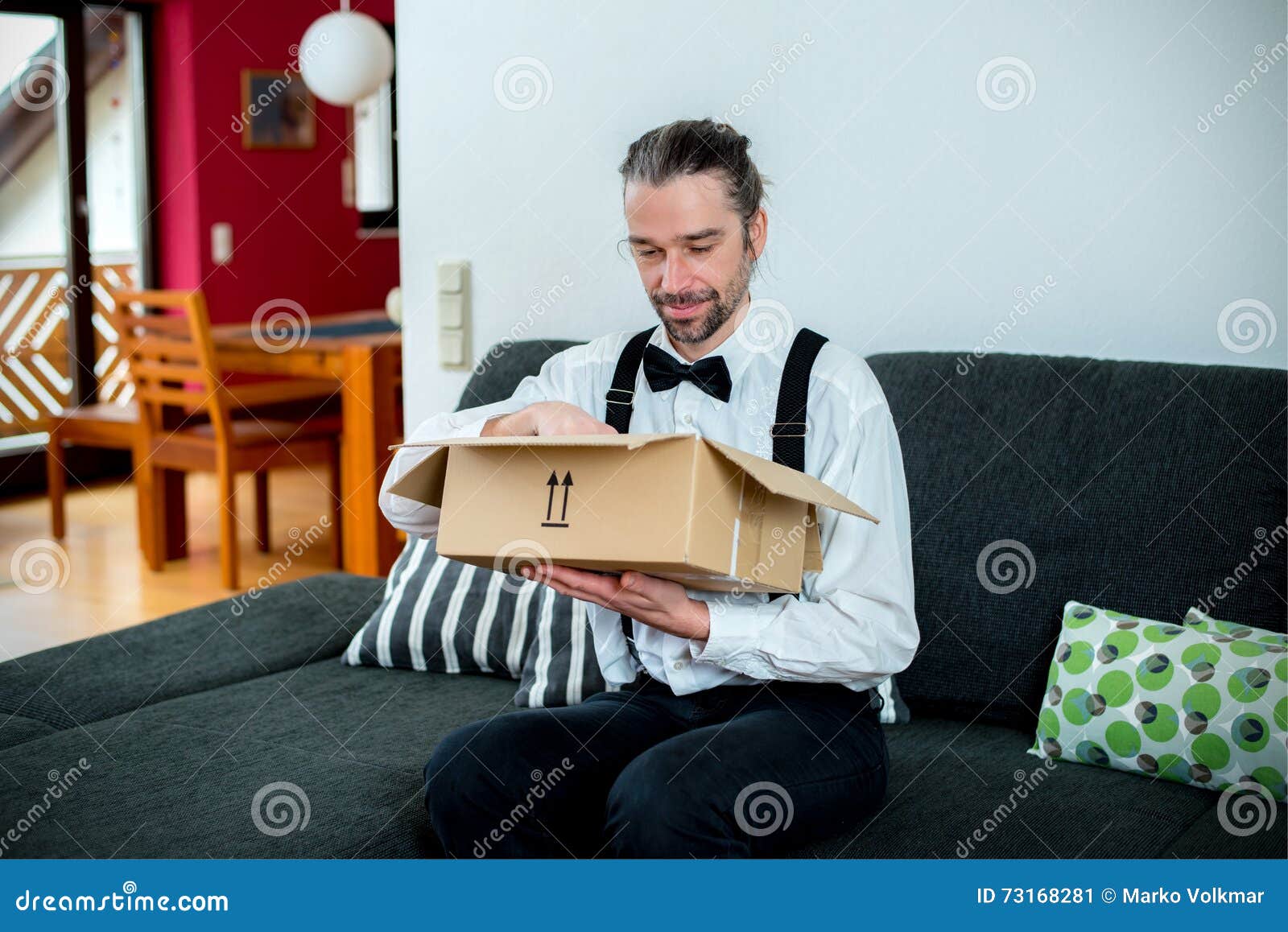 Man opening a package stock image. Image of elegant, beard - 73168281