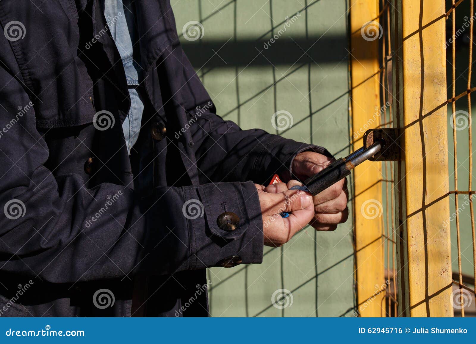 Man opening padlock stock photo. Image of appliance, human - 62945716
