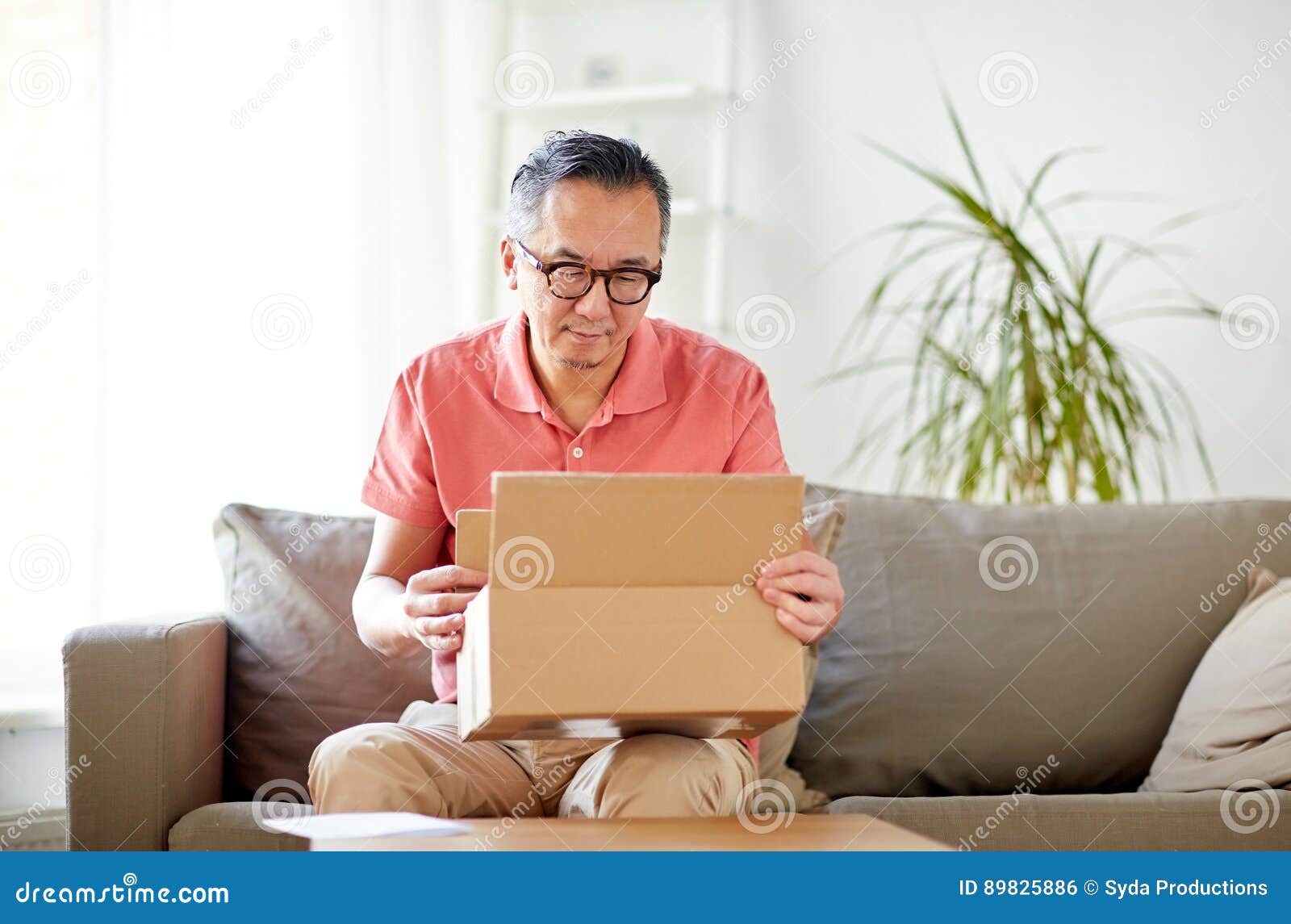 Man Opening Parcel Box at Home Stock Photo - Image of opening, male ...