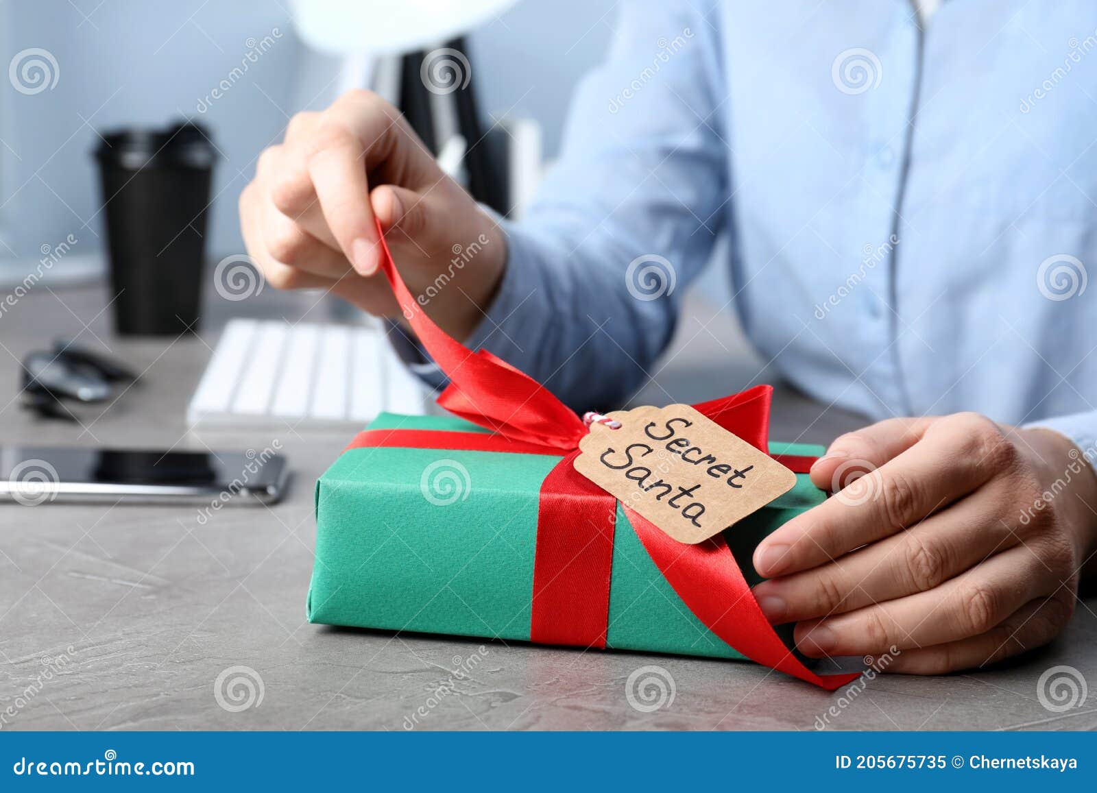 Man Opening Present from Secret Santa at Workplace, Closeup Stock Image ...