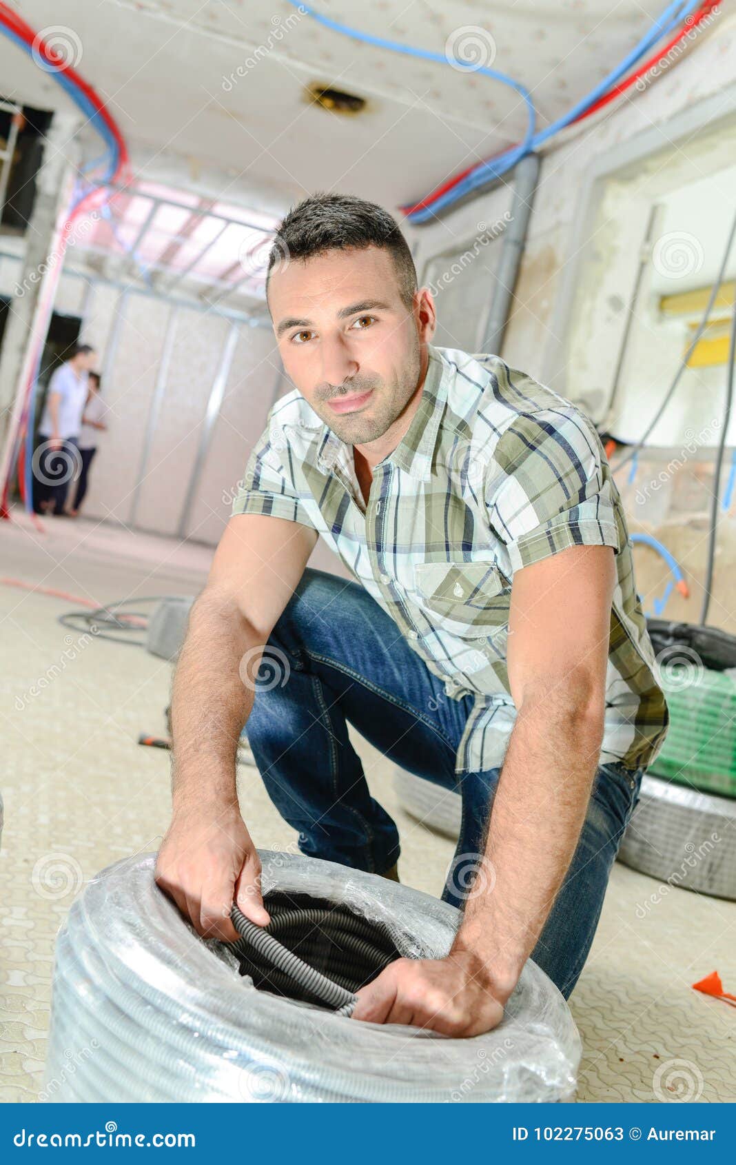 Man Opening Roll Cable Conduit Stock Image - Image of electric, roll ...