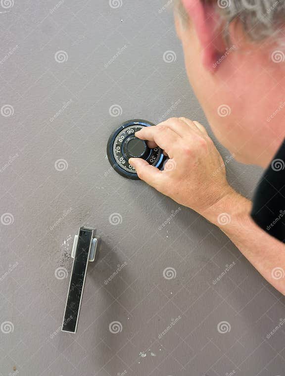 A man opening a safe stock photo. Image of invulnerable - 31579302