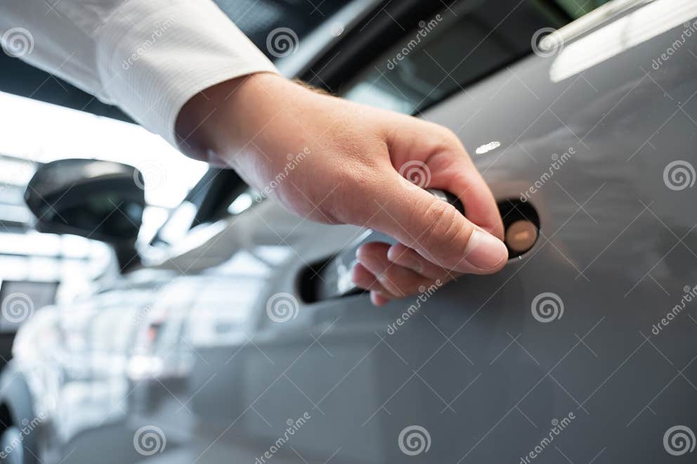 A Man Opens a Car Door with a Fingerprint. Integrated Handle. Stock ... A Man Opens a Car Door with a Fingerprint. Integrated Handle. Stock ...