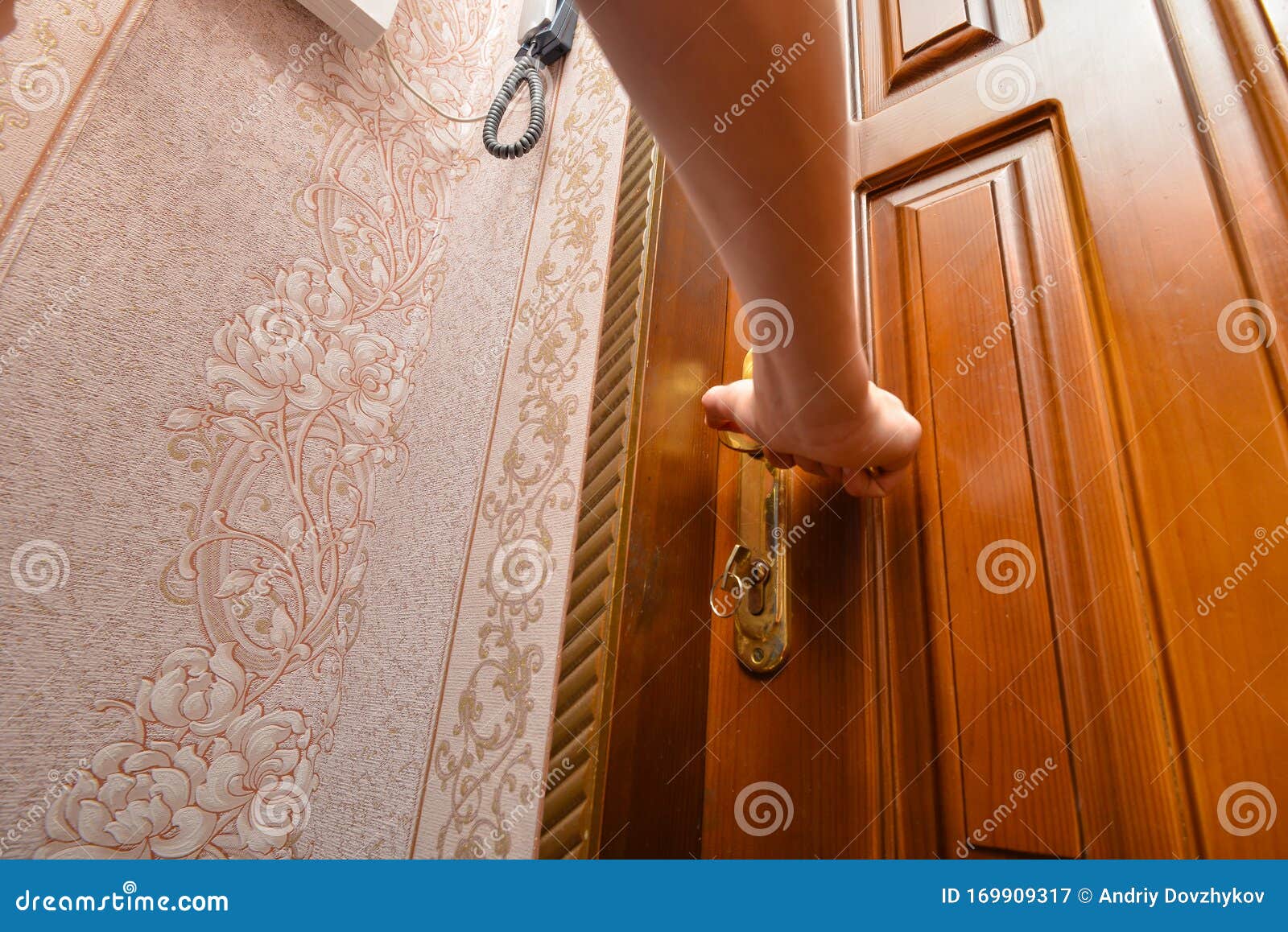A Man Opens the Front Door by Turning the Handle and Opening the Lock ...