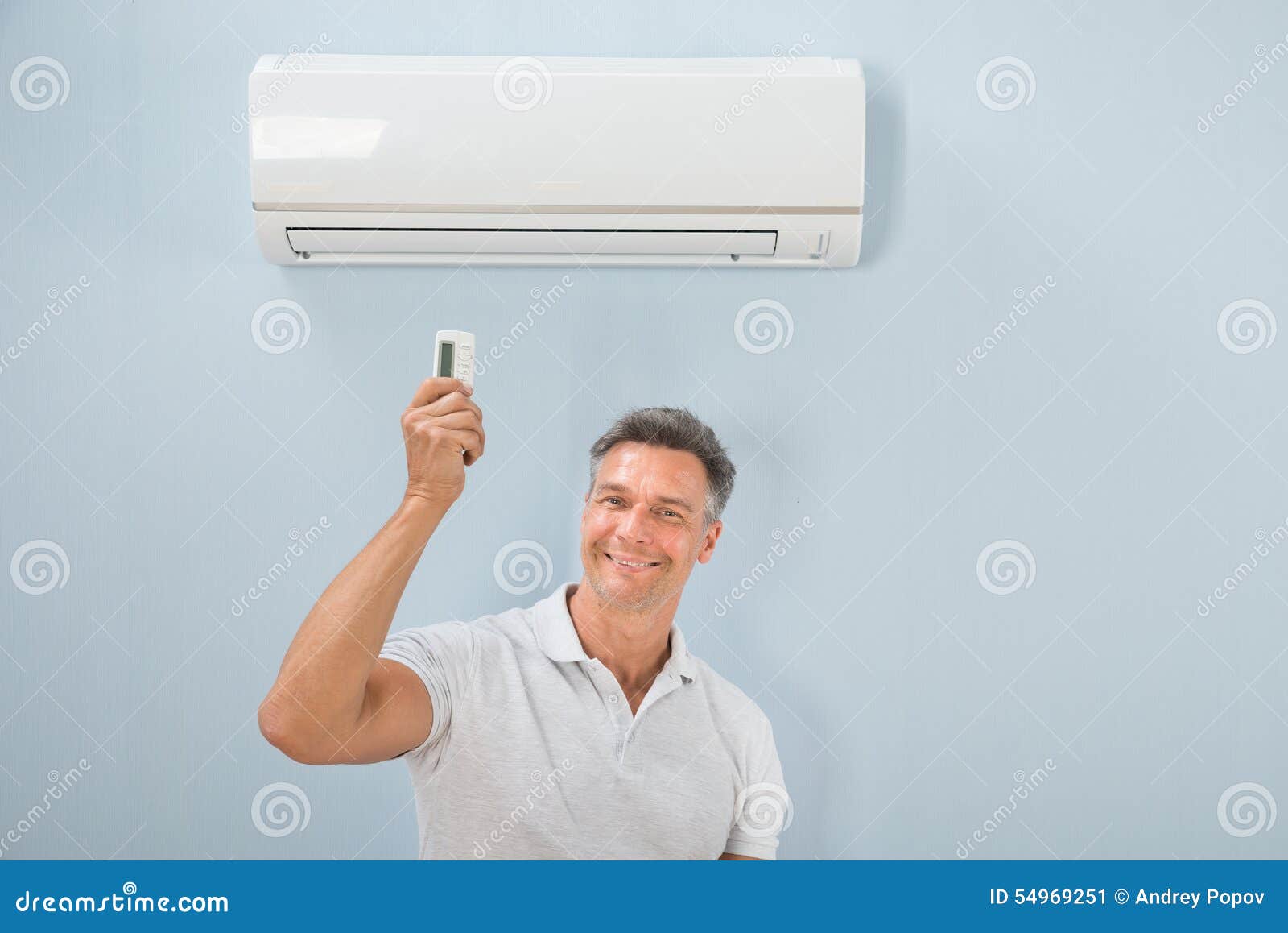 Man Operating Air Conditioner Stock Image - Image of adult, adjusting ...