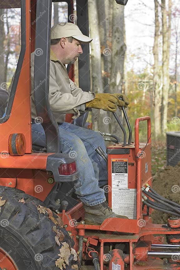 Man Operating Backhoe stock photo. Image of male, machine - 3411102