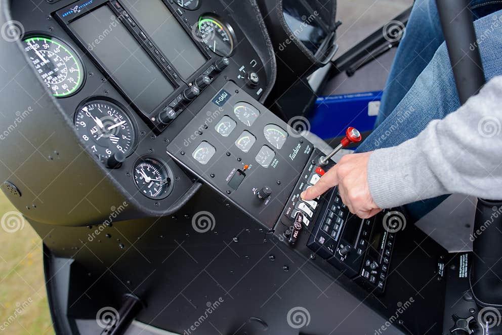 Man Operating Controls in Cockpit Stock Photo - Image of controls ...