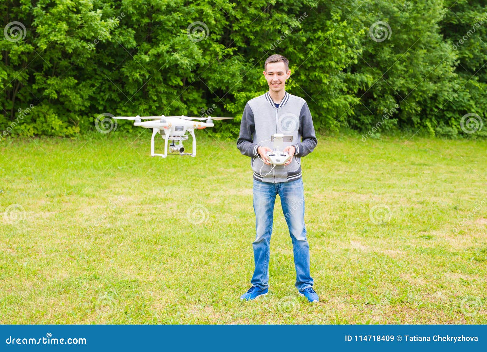 Ufa, Russia. - 6 June 2016 : Man Operating Drone Flying or Hovering by ...