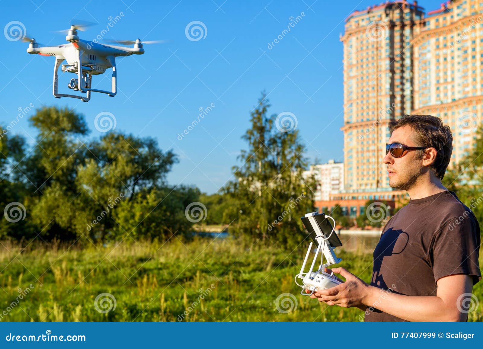 Man Operating Drone Quad Copter in City Park Stock Image - Image of ...